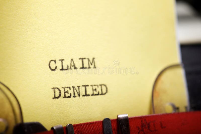 CLAIM DENIED Text on Easel with Wooden Figure, Meeting Concept Stock ...