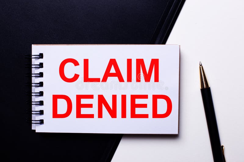 Claim Denied Words On A Card In Hand Of Businessman. Business Agreement ...