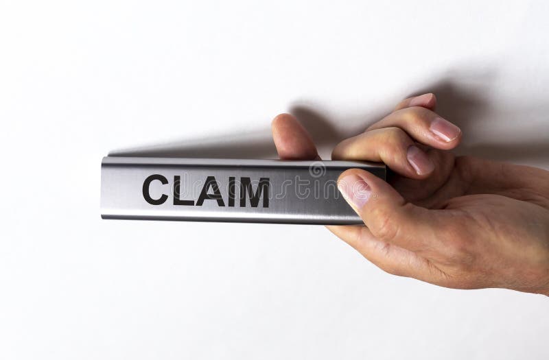 Claim Word on Silver Remote Control in Male Hand on White Background ...