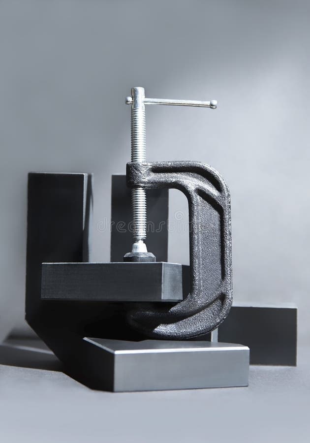 Clamp with Blocks on Gray Background Stock Image - Image of hold ...
