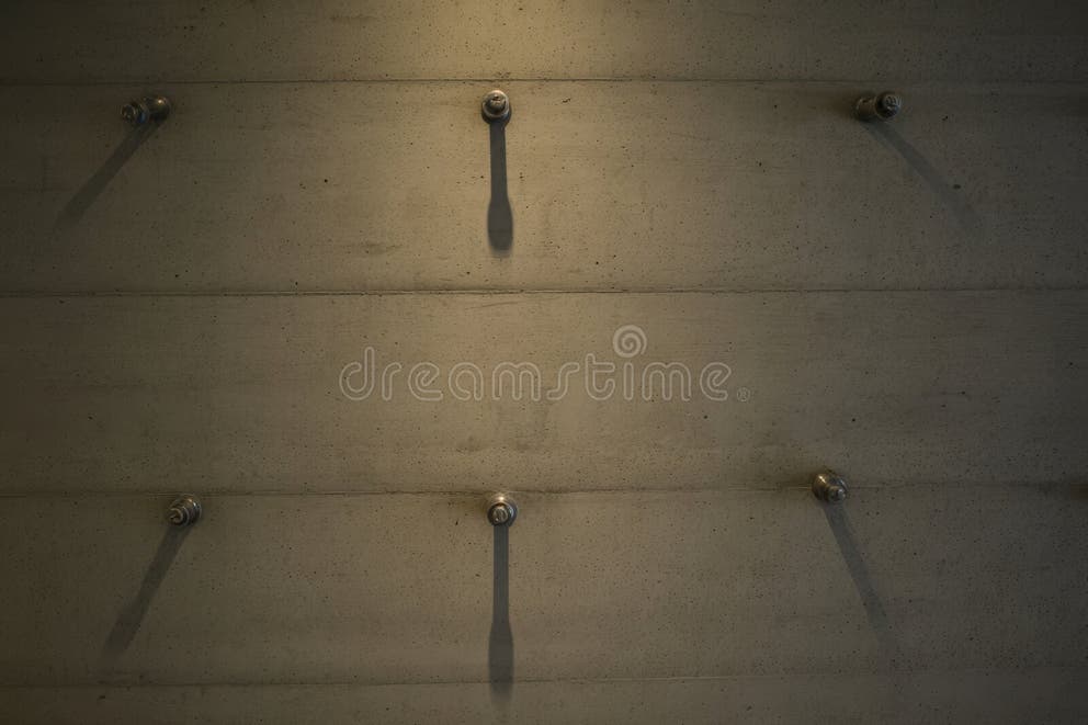 Clamp Secured To Concrete Wall with Precise Alignment and Shadow ...
