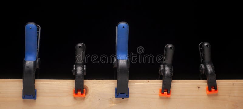 The Clamps on the Tree Stand in a Row . Stock Image - Image of work ...
