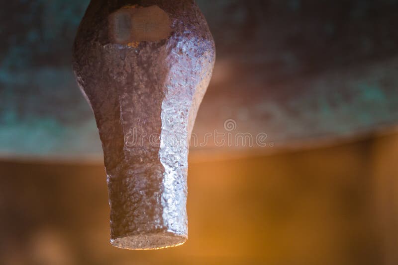 Clapper of ancient bell stock photo. Image of rusty - 130273412