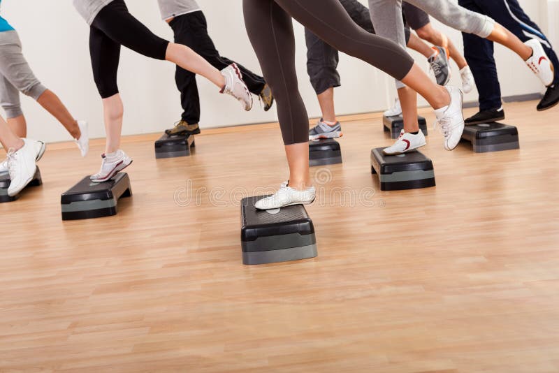 Class Doing Aerobics Balancing on Boards Stock Image - Image of group ...