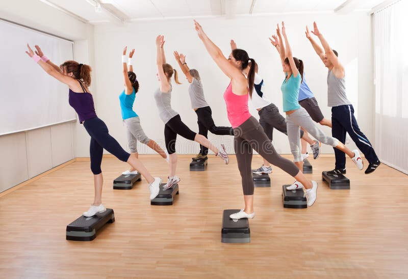 Class Doing Aerobics Balancing on Boards Stock Photo - Image of ...