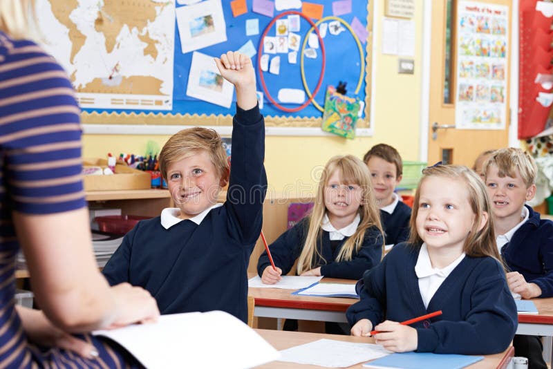Class of Elementary School Pupils Answering Question Stock Image ...