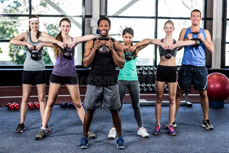 Class and Instructor Exercising with Kettlebells Stock Photo - Image of ...