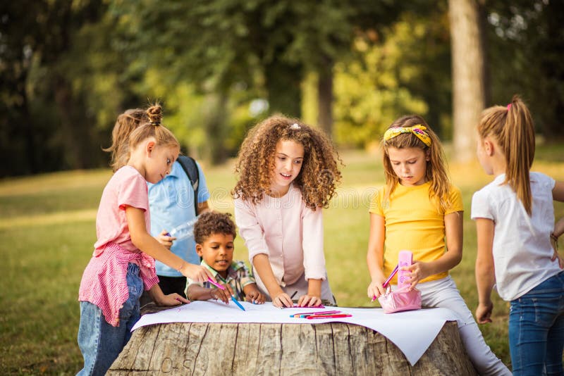 Large Group of People Writing Together in the Park Stock Image - Image ...