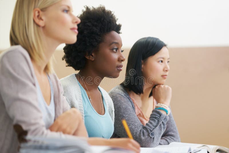 Class is in Session. Female University Students Sitting in an Exam Room ...