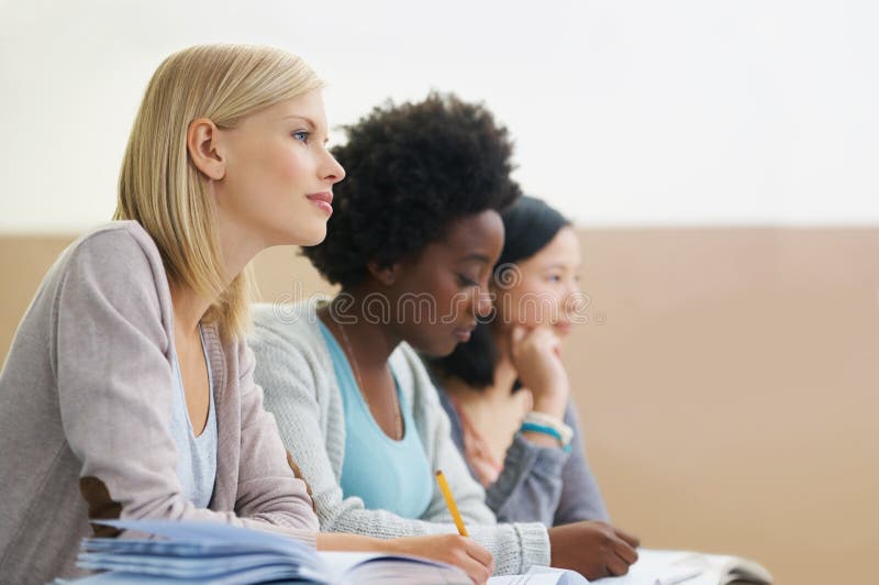 Class is in Session. Female University Students Sitting in an Exam Room ...