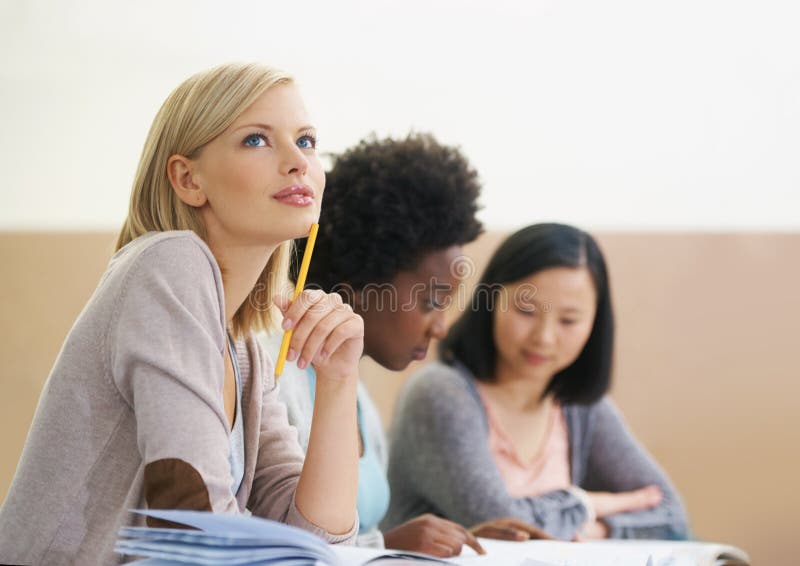 Class is in Session. Female University Students Sitting in an Exam Room ...