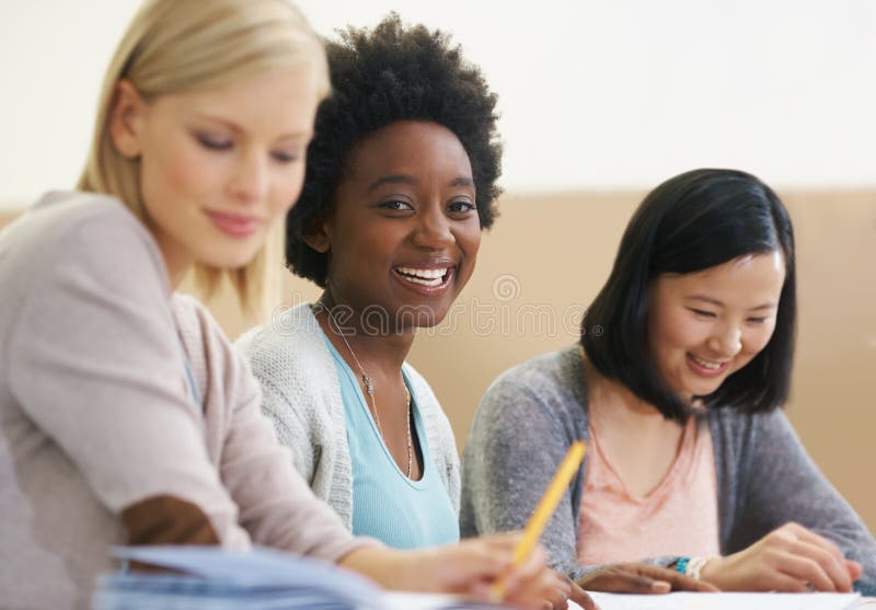 Class is in Session. Shot of Female University Students Sitting in an ...