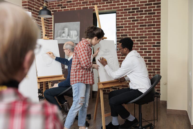 Class Teacher Explaining Sketch Process To Young Student Stock Image ...