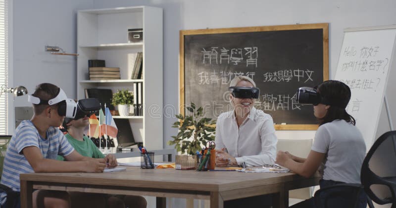 Class using VR headsets stock photo. Image of leaning - 153419112