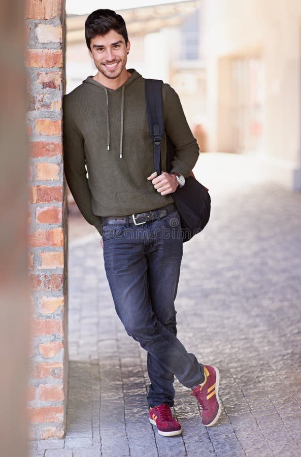Between Classes...Cropped Portrait of a Handsome Young Man Standing ...