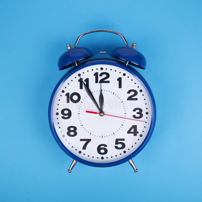 Classic Alarm Clock on Light Blue Background Stock Photo - Image of ...