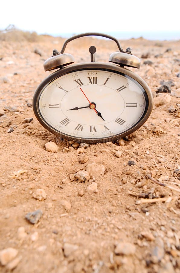 Classic Analog Clock in the Sand Stock Image - Image of imagery, sand ...