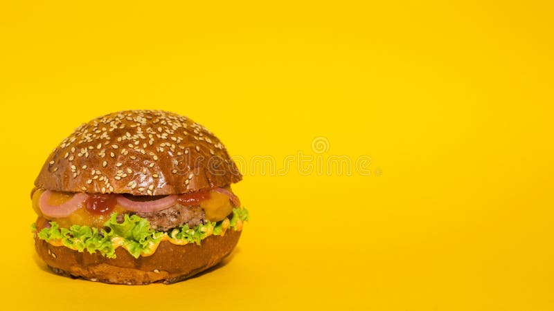 Classic Beef Burger with Yellow Backbround. High Quality Photo Stock ...