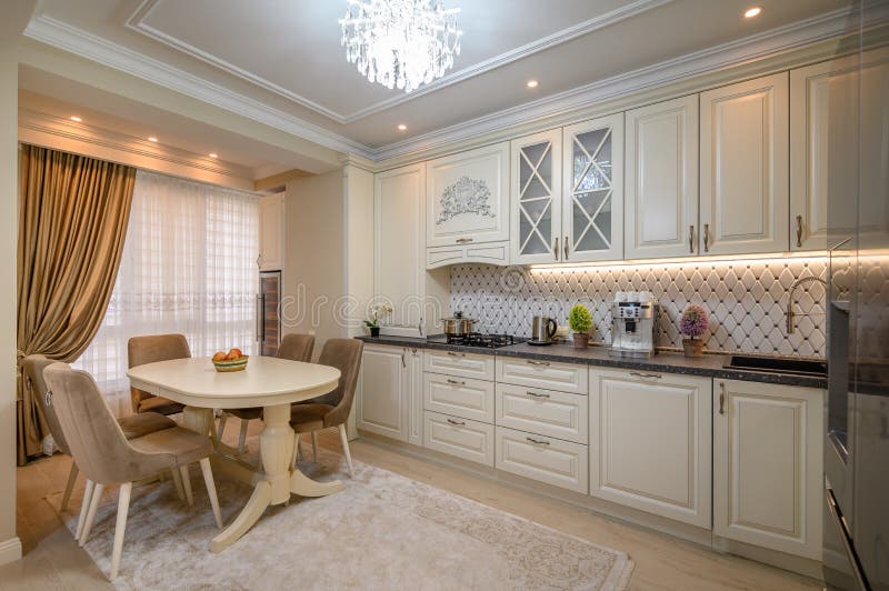 Classic Beige Kitchen with Counter Space and a Variety of Appliances ...