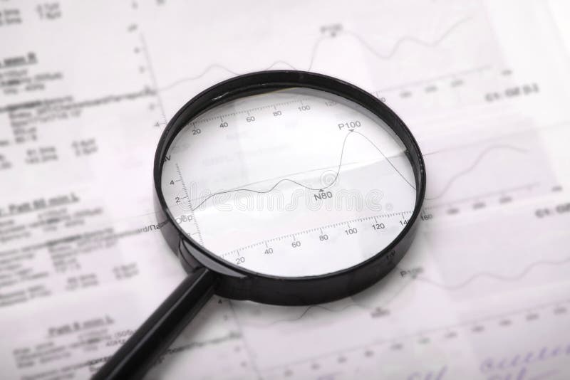 Classic Black Magnifying Glass Lying on a Medical Chart and Graph Stock ...