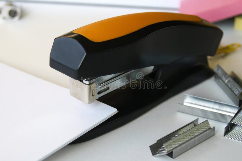 A Stapler And The Documents Files In Office On The Table, Staple The ...