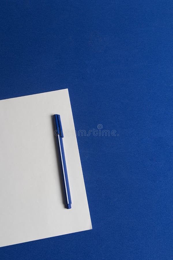Classic Blue Table with Blank Sheet of Paper and Blue Pen Ready for ...