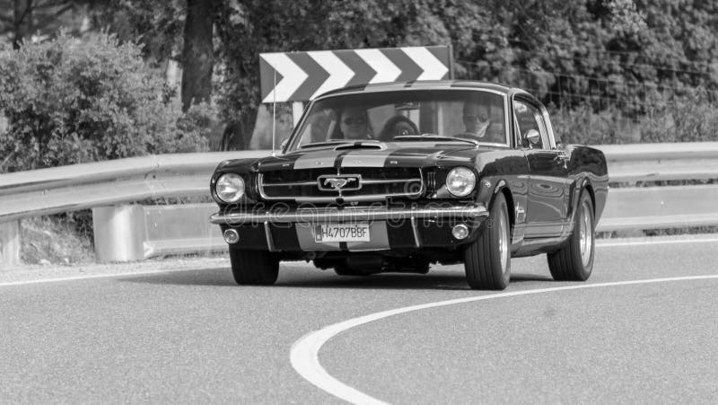 Classic Car, Ford Mustang Rolling Down the Road in Madrid. Editorial ...