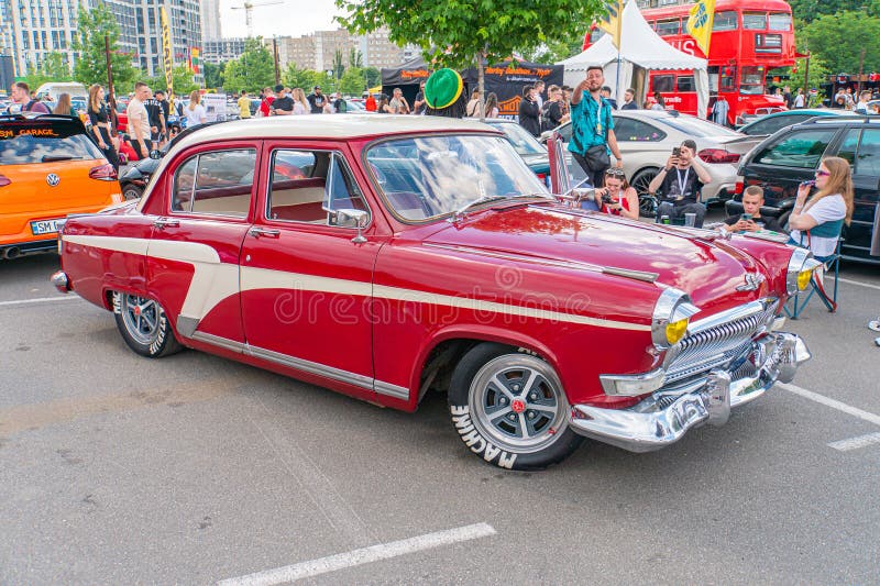 A Classic Car with a Two-tone Red and Silver Color Scheme is Parked ...