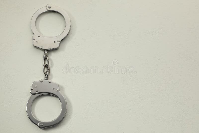 Classic Chain Handcuffs on White Table, Top View. Space for Text Stock ...