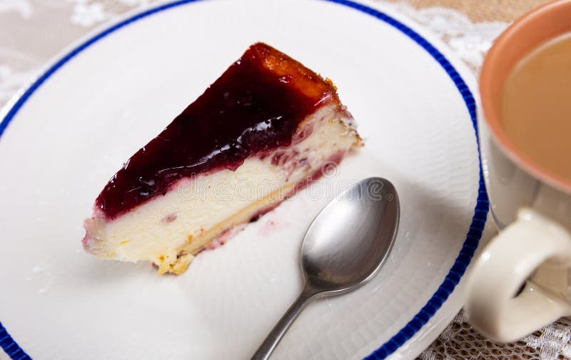Cherry Cheesecake Served with Sweet Berry Sauce in Cafe Stock Image ...