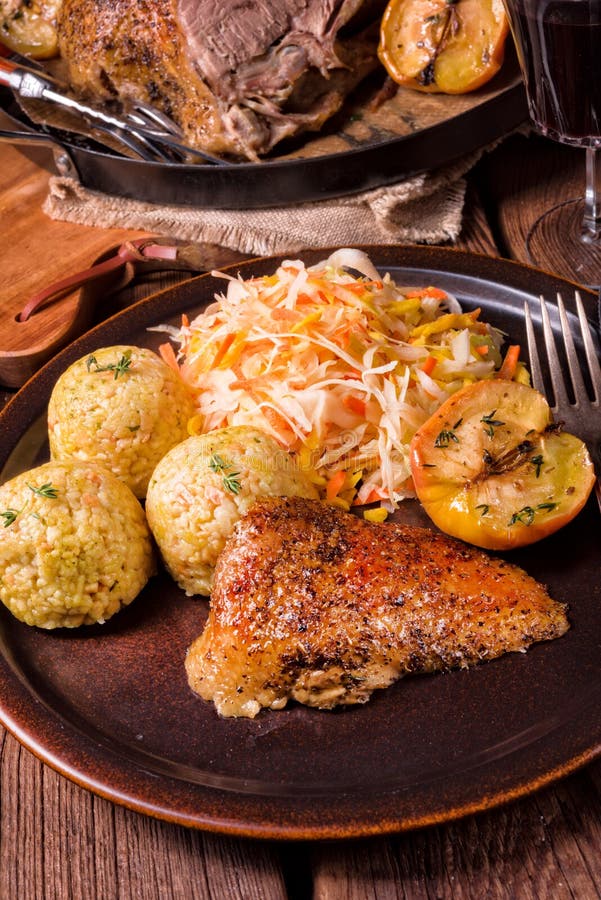 A Classic and Crispy Roasted Duck with Cabbage and Dumplings Stock ...