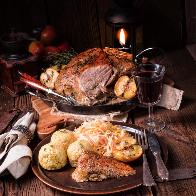 A Classic and Crispy Roasted Duck with Cabbage and Dumplings Stock ...