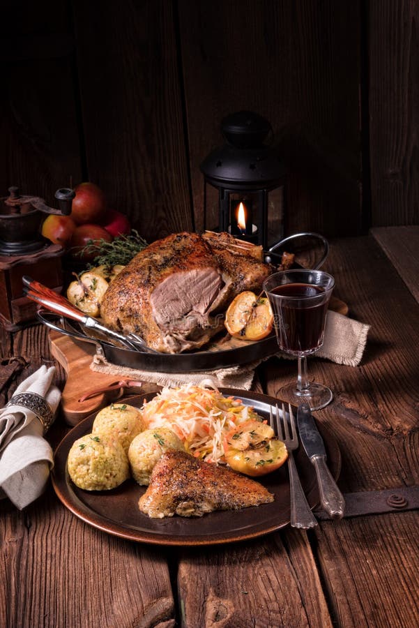 A Classic and Crispy Roasted Duck with Cabbage and Dumplings Stock ...