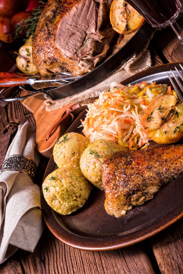 A Classic and Crispy Roasted Duck with Cabbage and Dumplings Stock ...