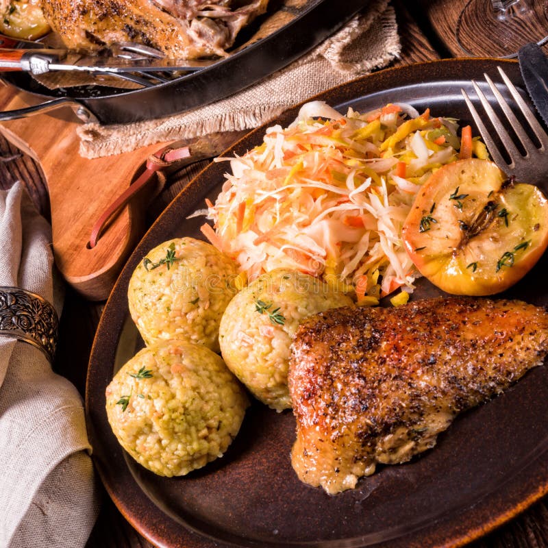 A Classic and Crispy Roasted Duck with Cabbage and Dumplings Stock ...
