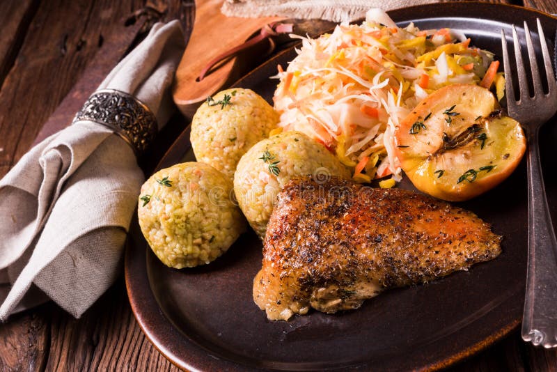 A Classic and Crispy Roasted Duck with Cabbage and Dumplings Stock ...