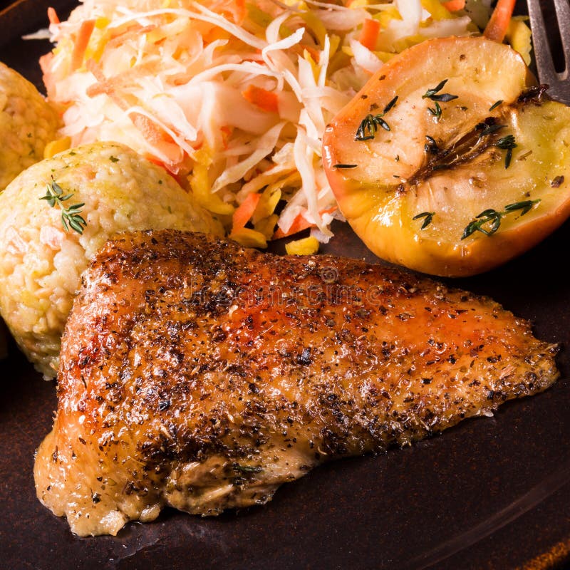 A Classic and Crispy Roasted Duck with Cabbage and Dumplings Stock ...