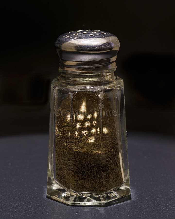 A Classic Diner Pepper Shaker Sitting in the Spotlight from Above Stock ...