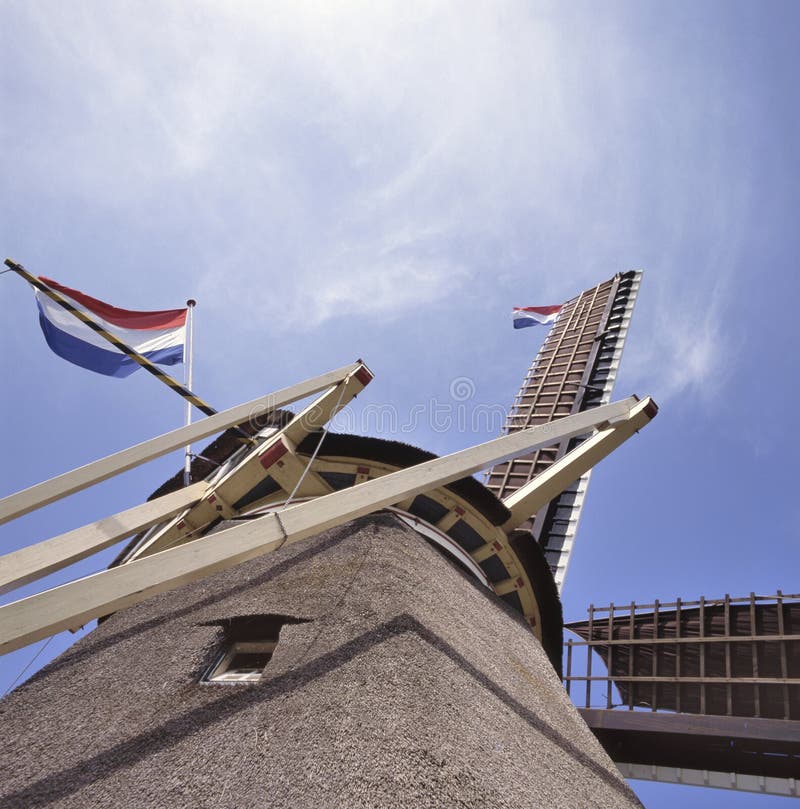 Classic Dutch Windmill with Two Dutch National Flags Stock Image ...