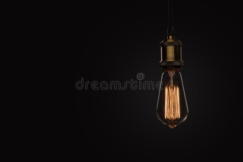 Classic Edison Light Bulb on Black Background Stock Image - Image of ...