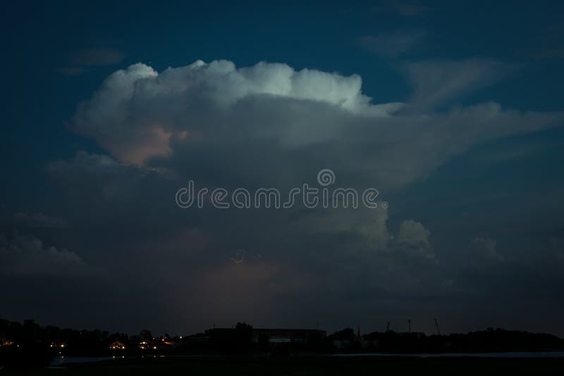 A Storm Cloud Cumulonimbus is Illuminated by Lightning Stock Photo ...