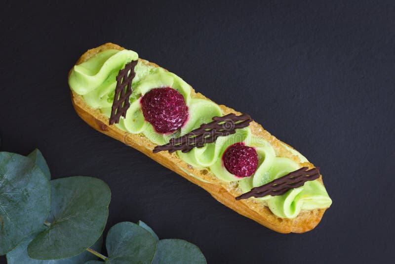 Classic French Pistachio Eclair Decor by Raspberry and Chocolate Stock ...