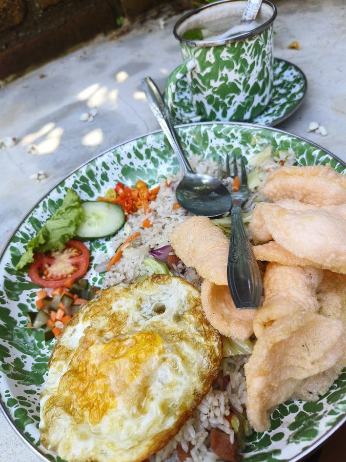 Classic Fried Rice with Additional Fried Egg, Crackers, and Pickles ...