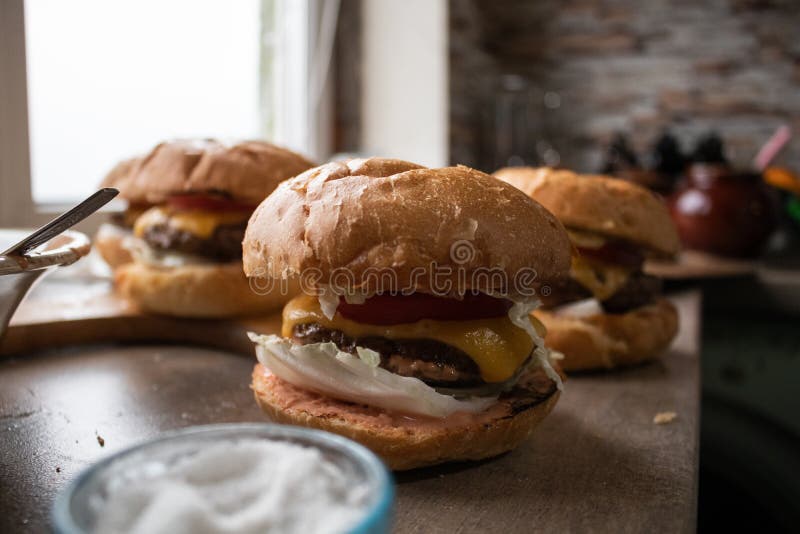 Classic GamBurger with Tomato on Wooden Board Stock Photo - Image of ...