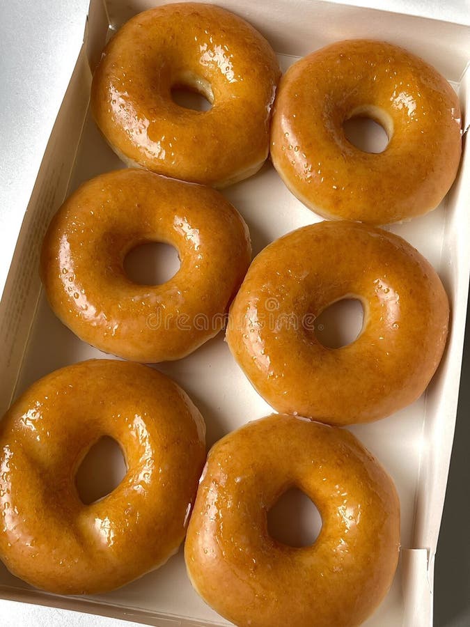 A Classic Glazed Donut with a Soft, Fluffy Texture and a Sweet, Glossy ...