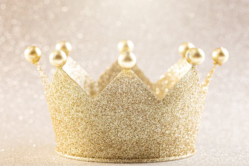 A a Classic Golden Crown on a Glittery Golden Background Stock Photo ...