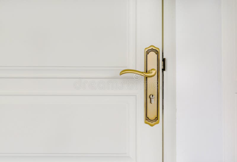 Classic Golden Door Handle on White Door Stock Photo - Image of ...