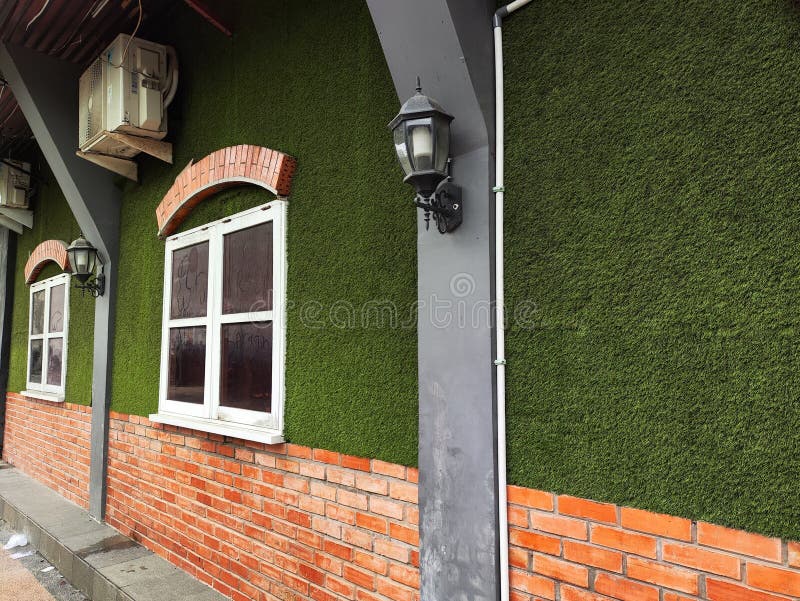 Green Facade of the House with White Square Windows Stock Photo - Image ...
