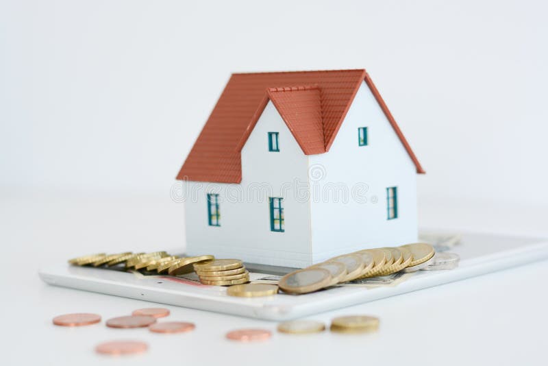 Classic Home Model with Pile of Coins and Banknotes Isolated on White ...