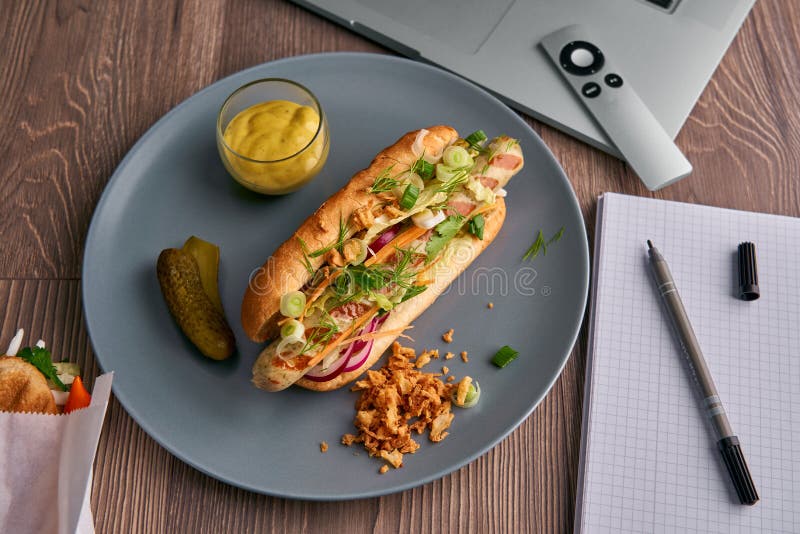 Classic Hot Dog on the Desktop Surrounded by Modern Devices, a Computer ...